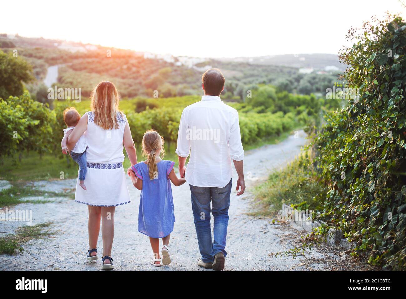 Family outdoors back view Stock Photo - Alamy