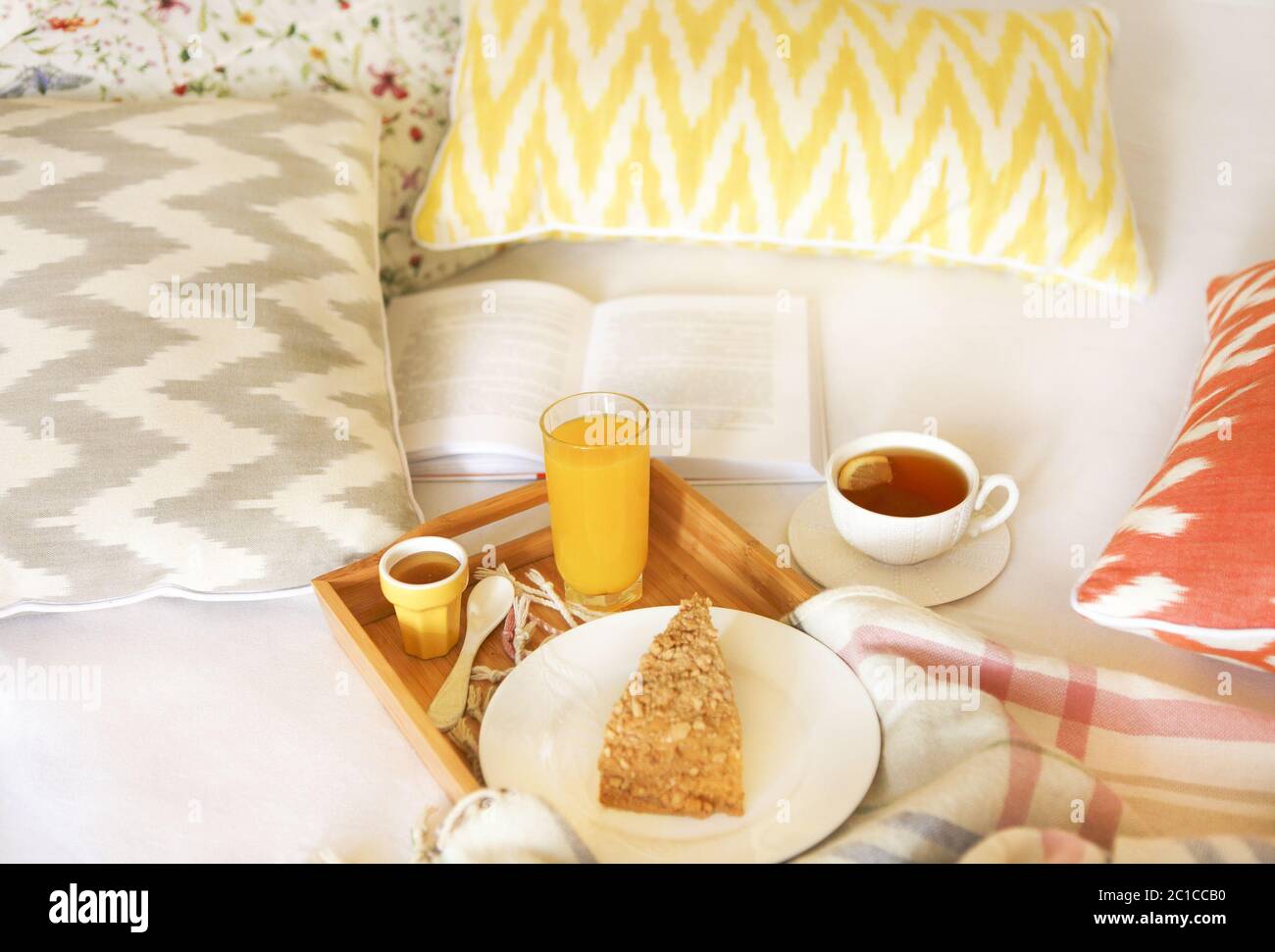 Cozy breakfast in bed with tea Stock Photo - Alamy