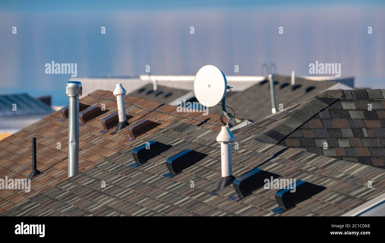 Panorama frame Television satellite dish mounted on a roof Stock Photo ...