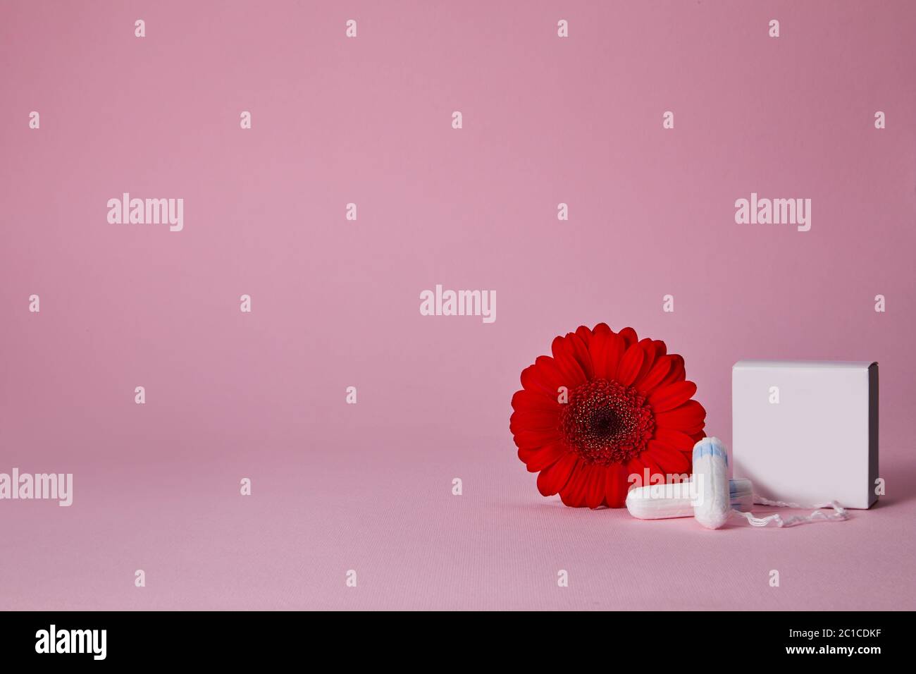 menstrual sanitary cotton tampons, box for tampons and red flower on ...