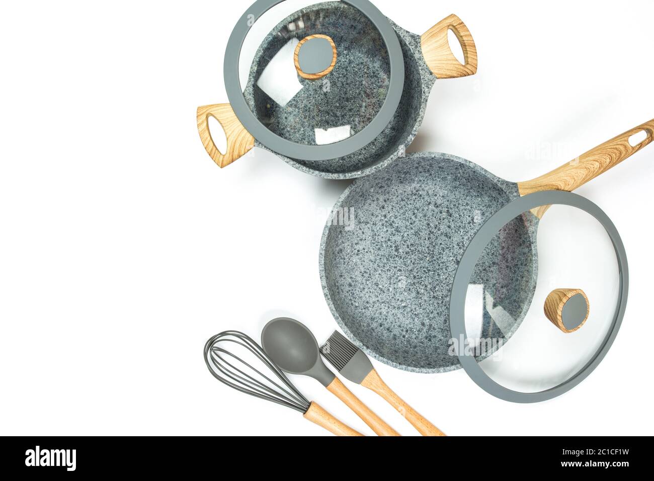 Photo of a ceramic frying pan with a lid and pans with a lid isolated ...