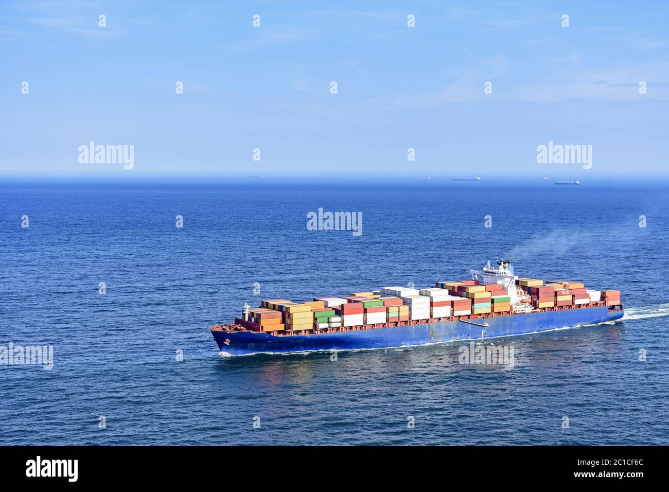 Cargo ship over the sea Stock Photo - Alamy