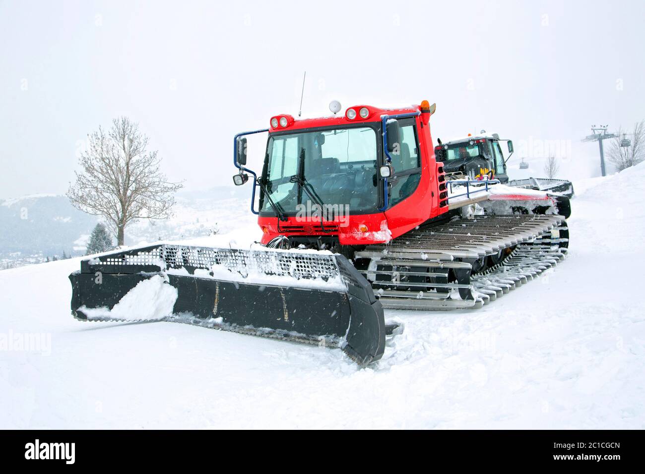 red snowmobile in winter scenery Stock Photo - Alamy