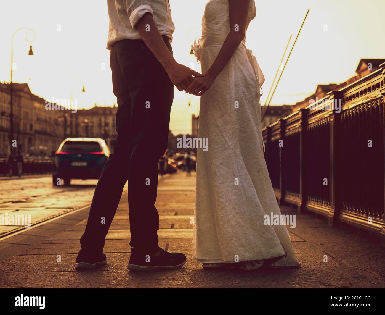 Newlyweds in town holding hands Stock Photo - Alamy Newlyweds in town holding hands Stock Photo - Alamy