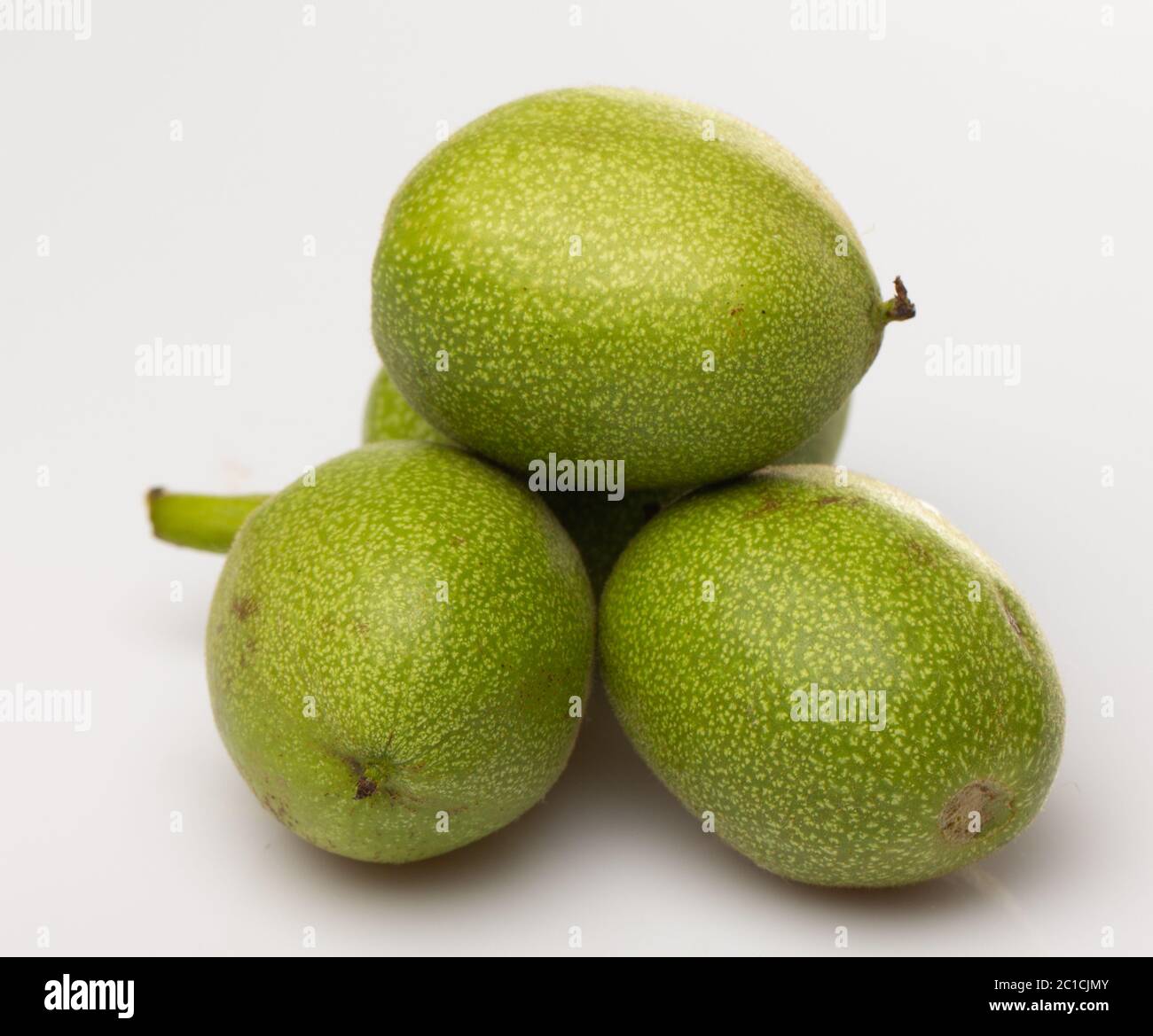 A group of salted walnuts on a white background. Medicinal oreg with ...