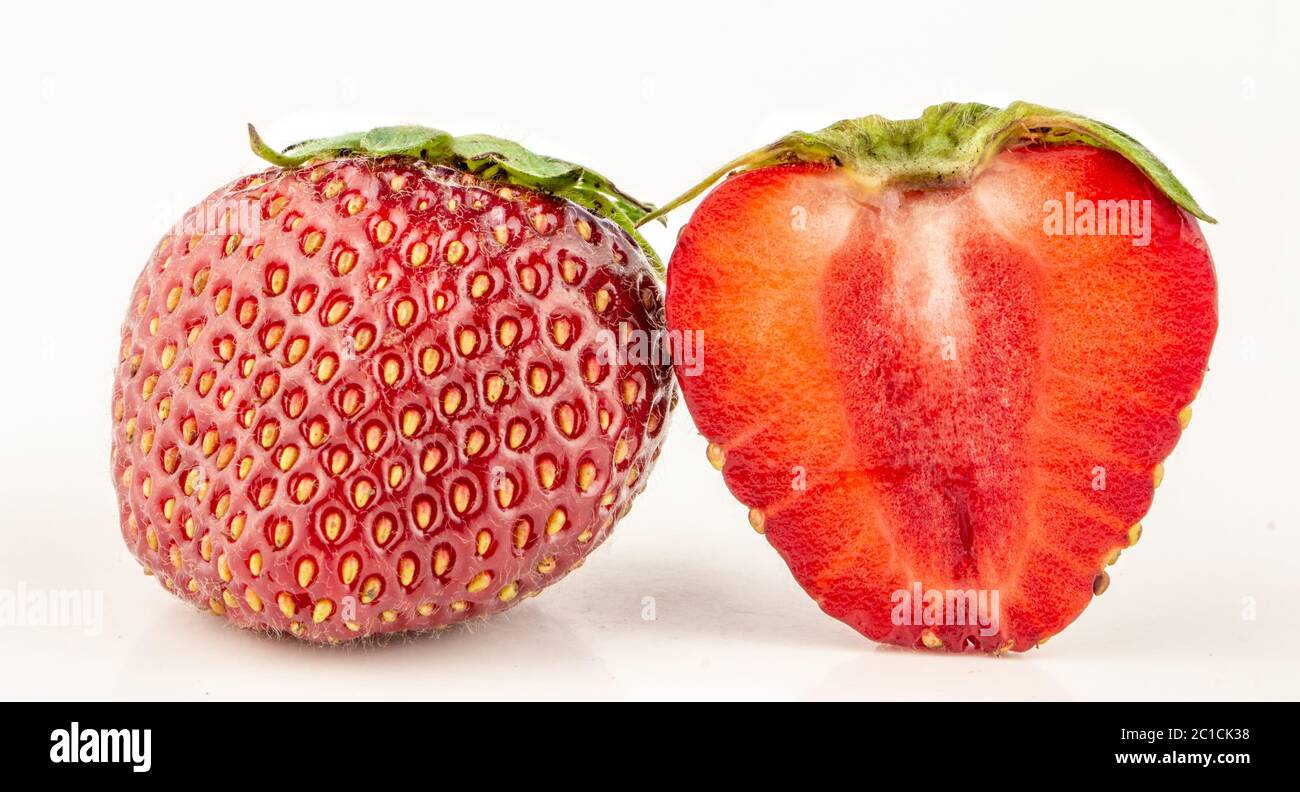 Strawberries with strawberry slice. Isolated on a white background ...