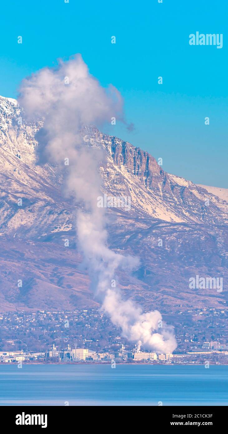 Vertical Plume of white smoke rising from a fire Stock Photo - Alamy