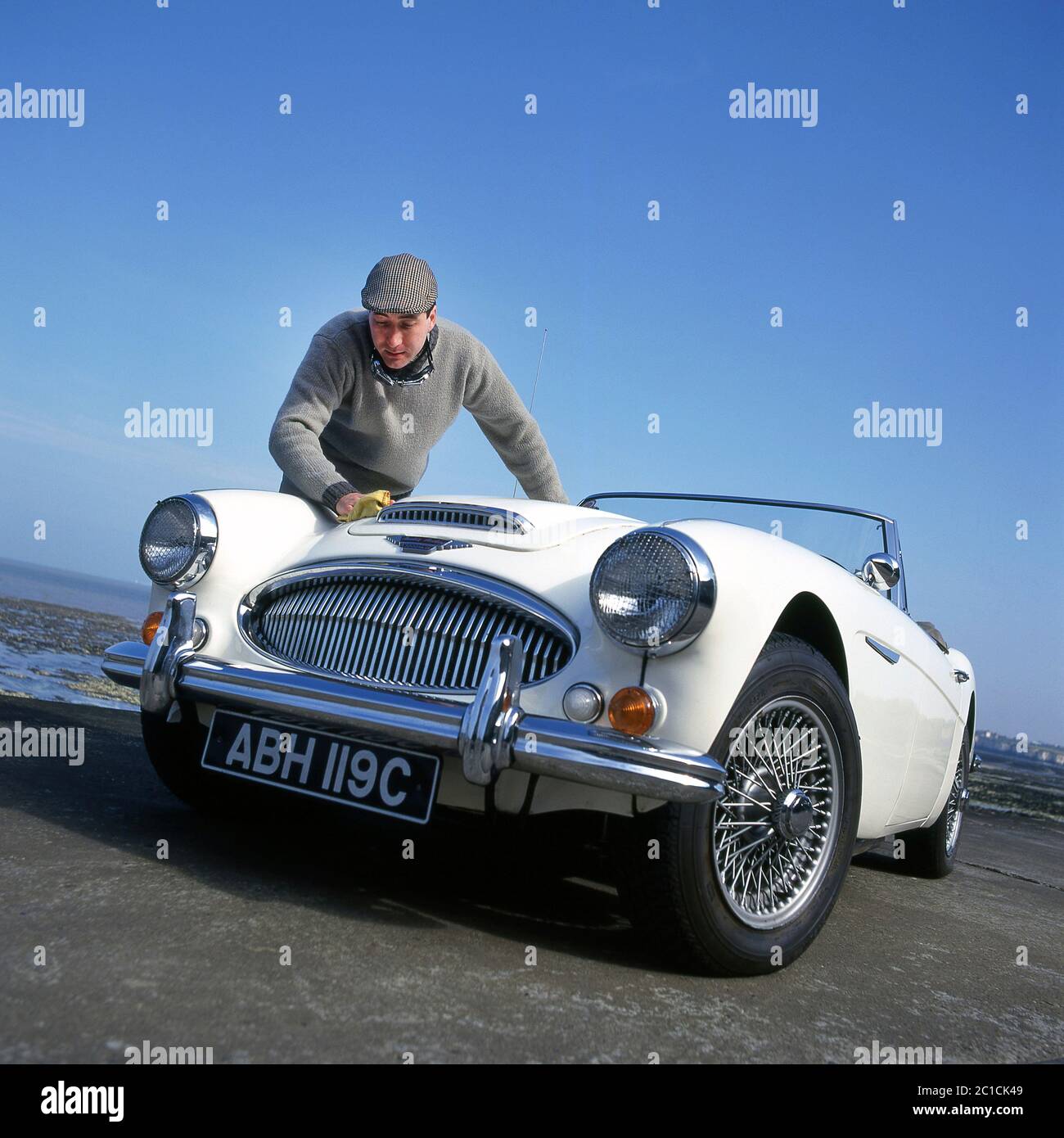 Classic car owner polishing a 1965 Austin Healey 3000 MKIII Stock Photo ...