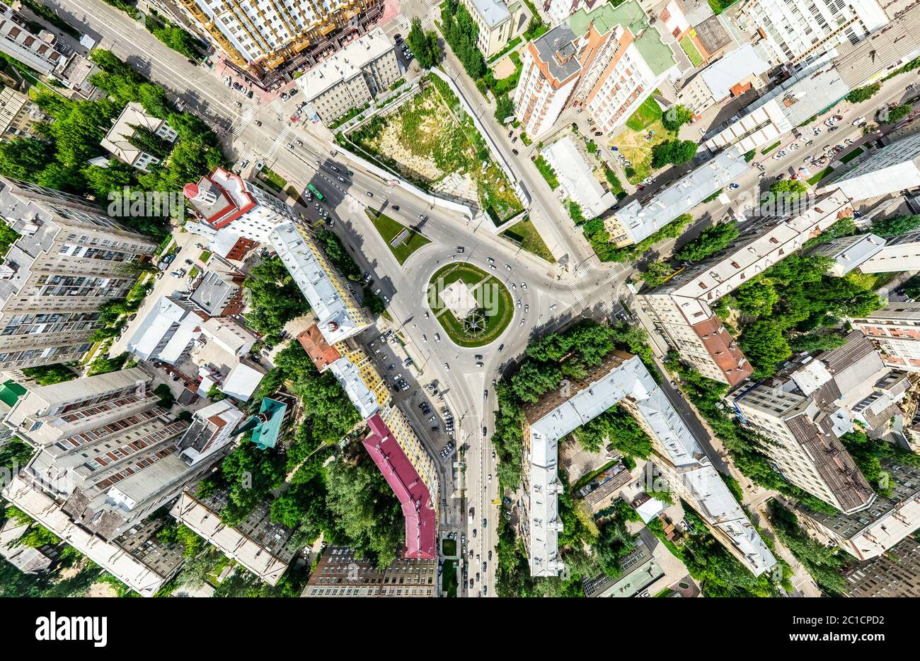 Aerial city view with crossroads and roads, houses, buildings, parks ...
