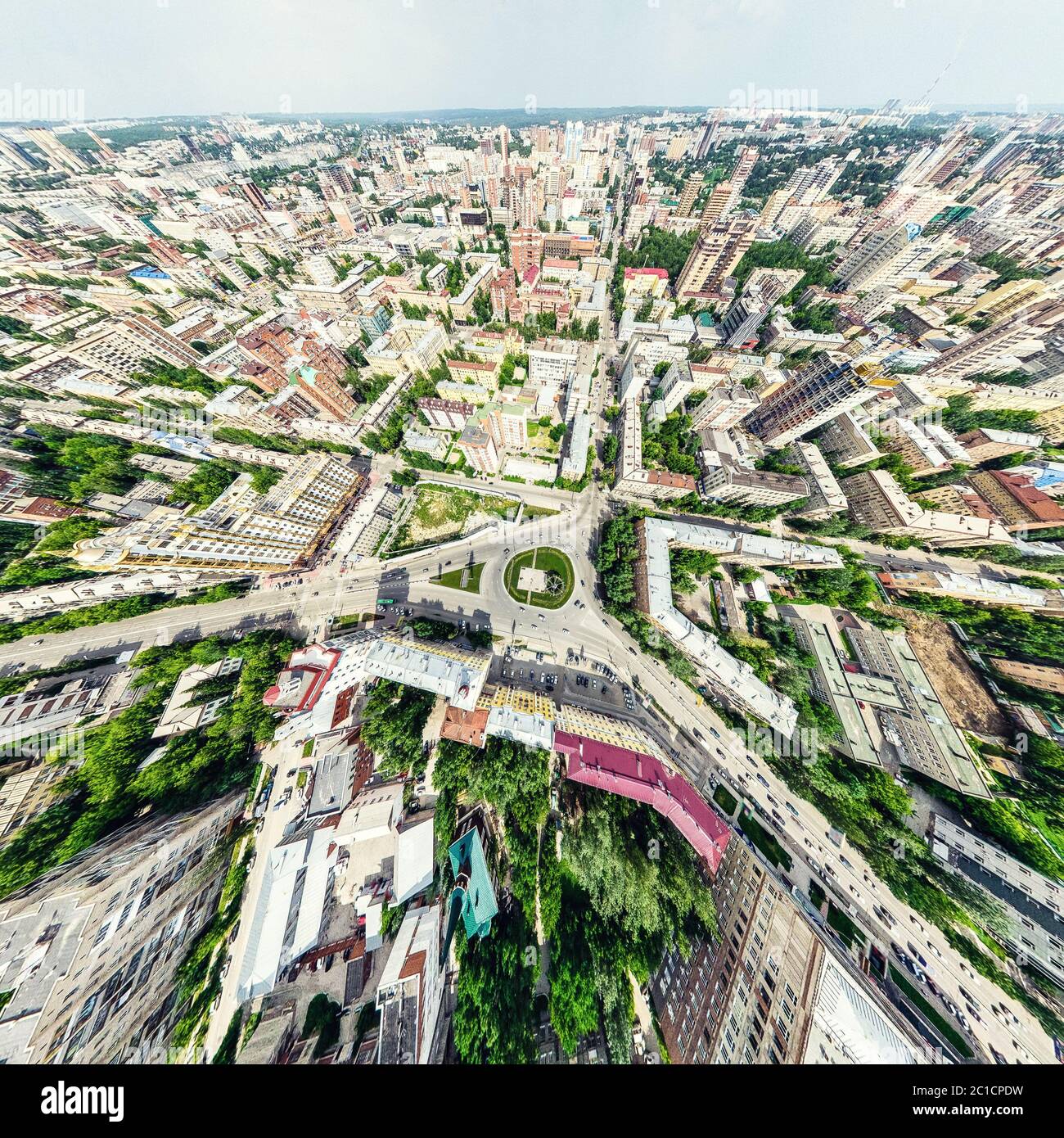 Aerial city view with crossroads and roads, houses, buildings, parks ...