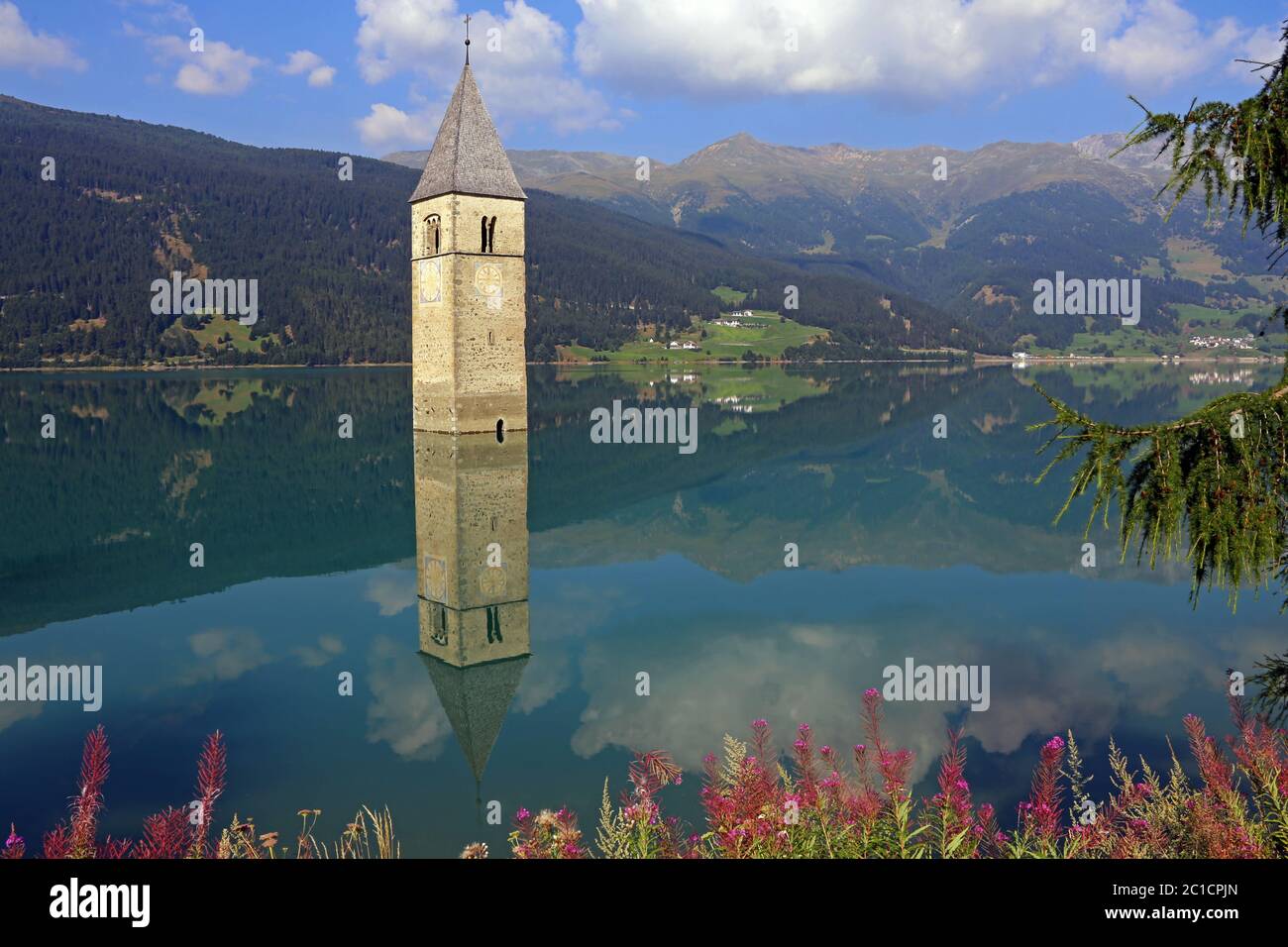 Sunken church tower in the Reschensee at the Reschen Pass Stock Photo ...