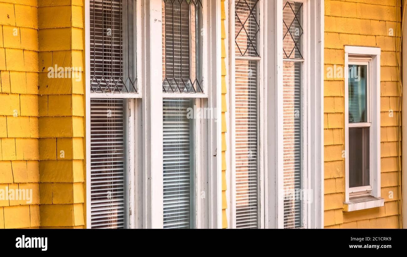 Panorama Building exterior with yellow wall cladding and awning over ...