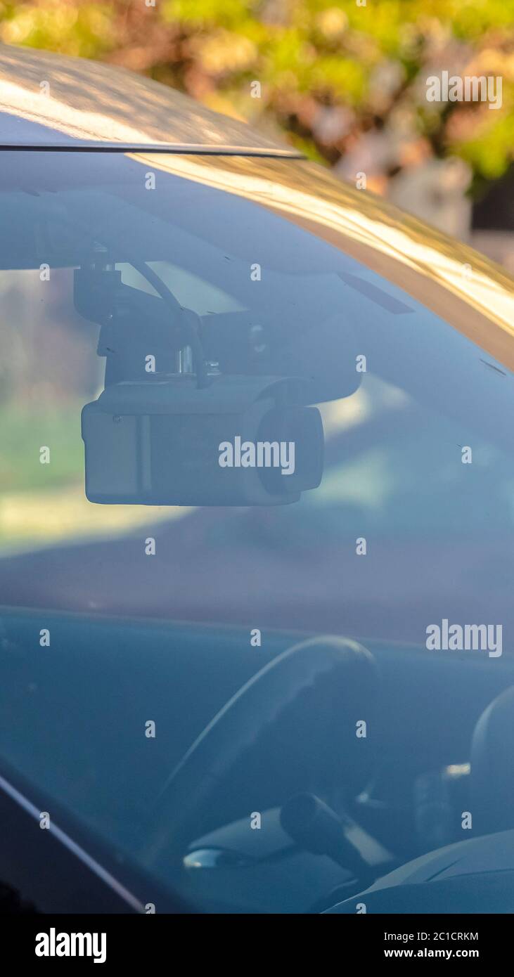 Vertical crop Windshield of sheriffs car with dashboard camera Stock ...