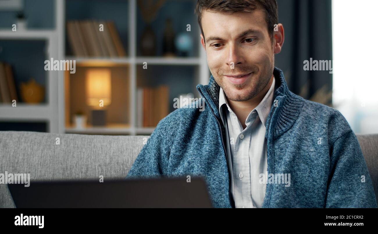 Man using digital gadget home Stock Photo - Alamy