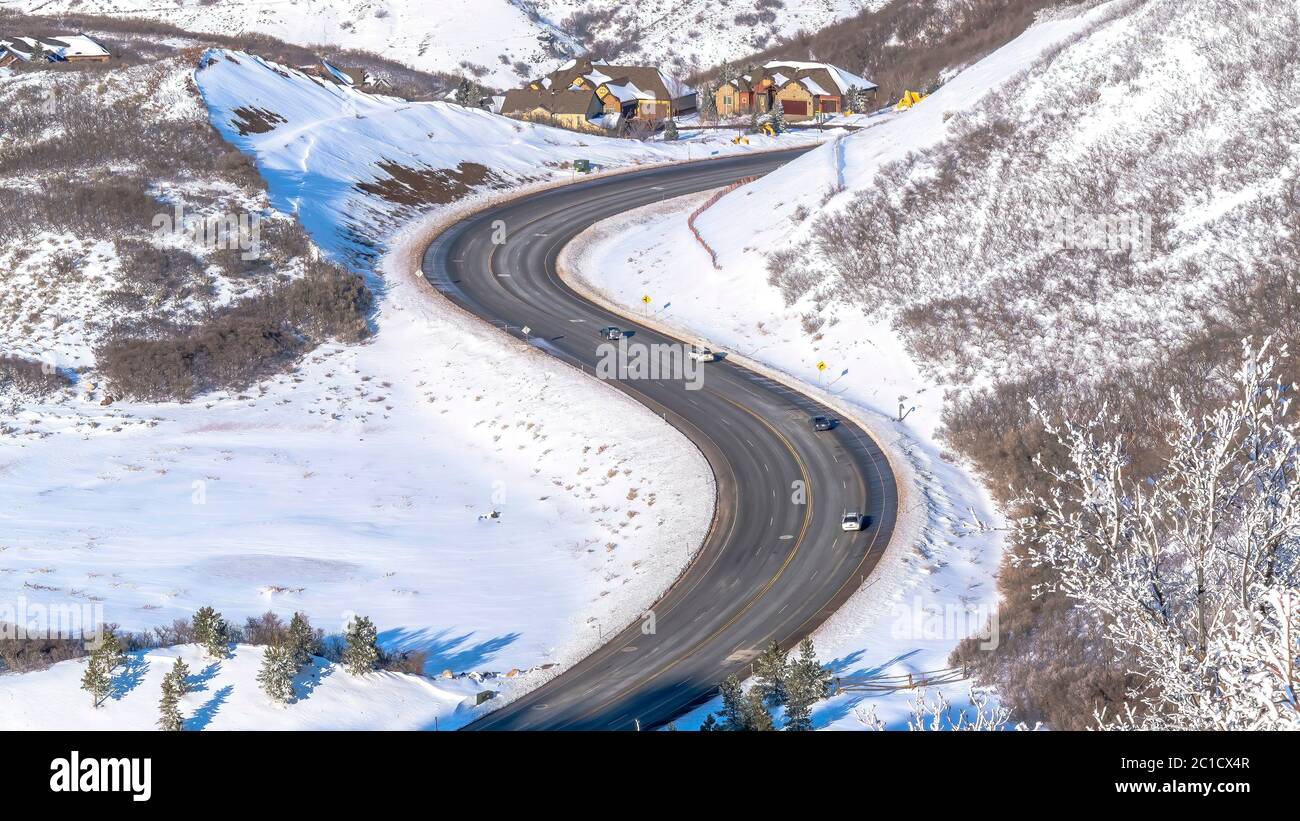 Panorama Wasatch Mountain landscape with road and houses on snowy ...