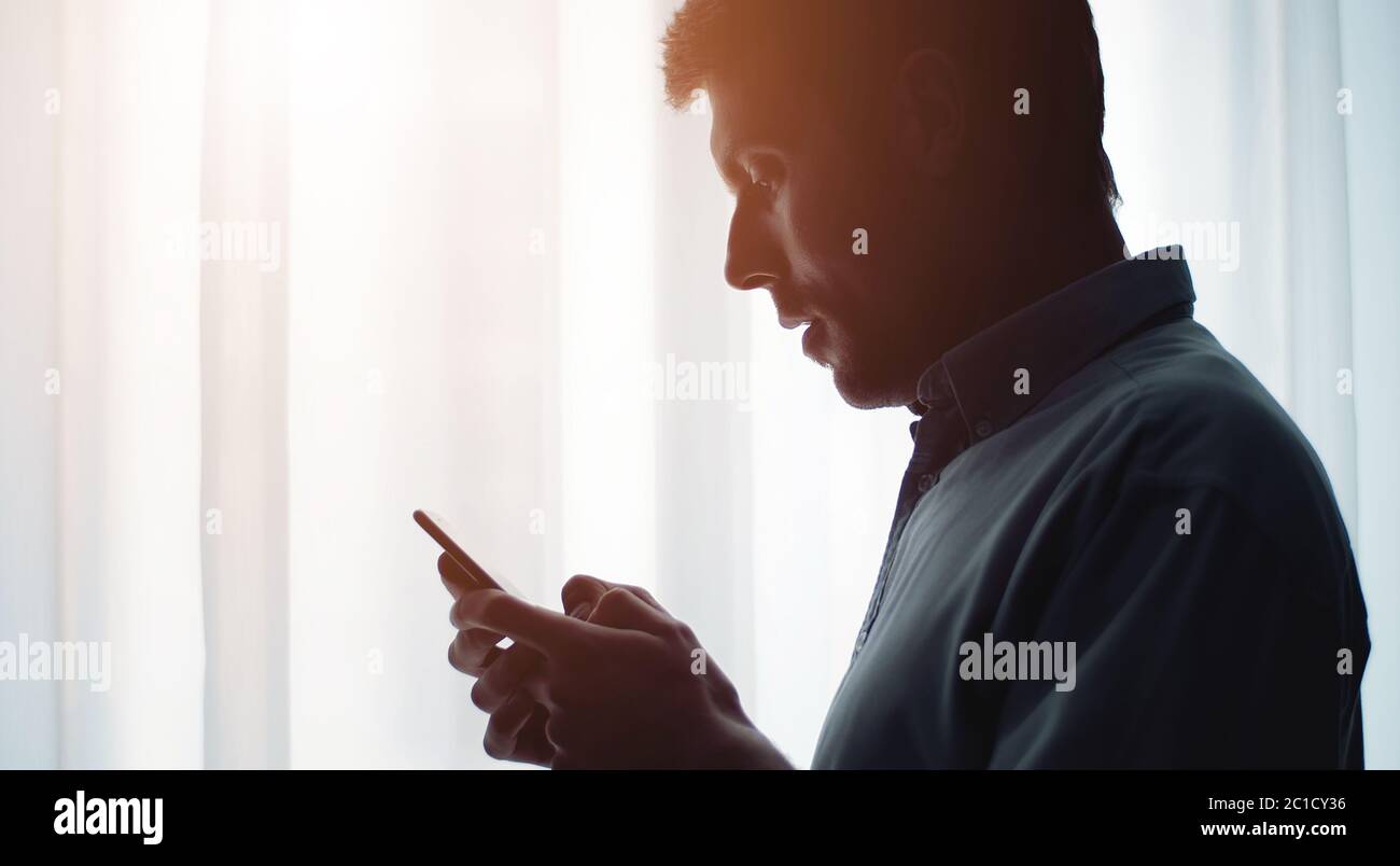 Man looking at a smartphone hi-res stock photography and images - Alamy