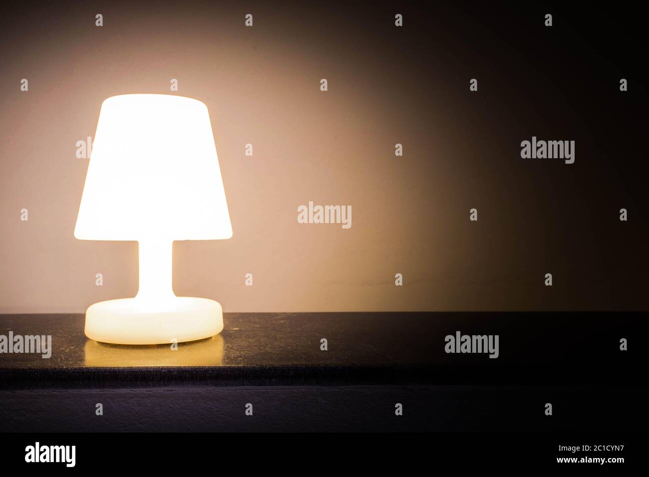 Lamp night light in a dark background. Vintage effect style picture ...