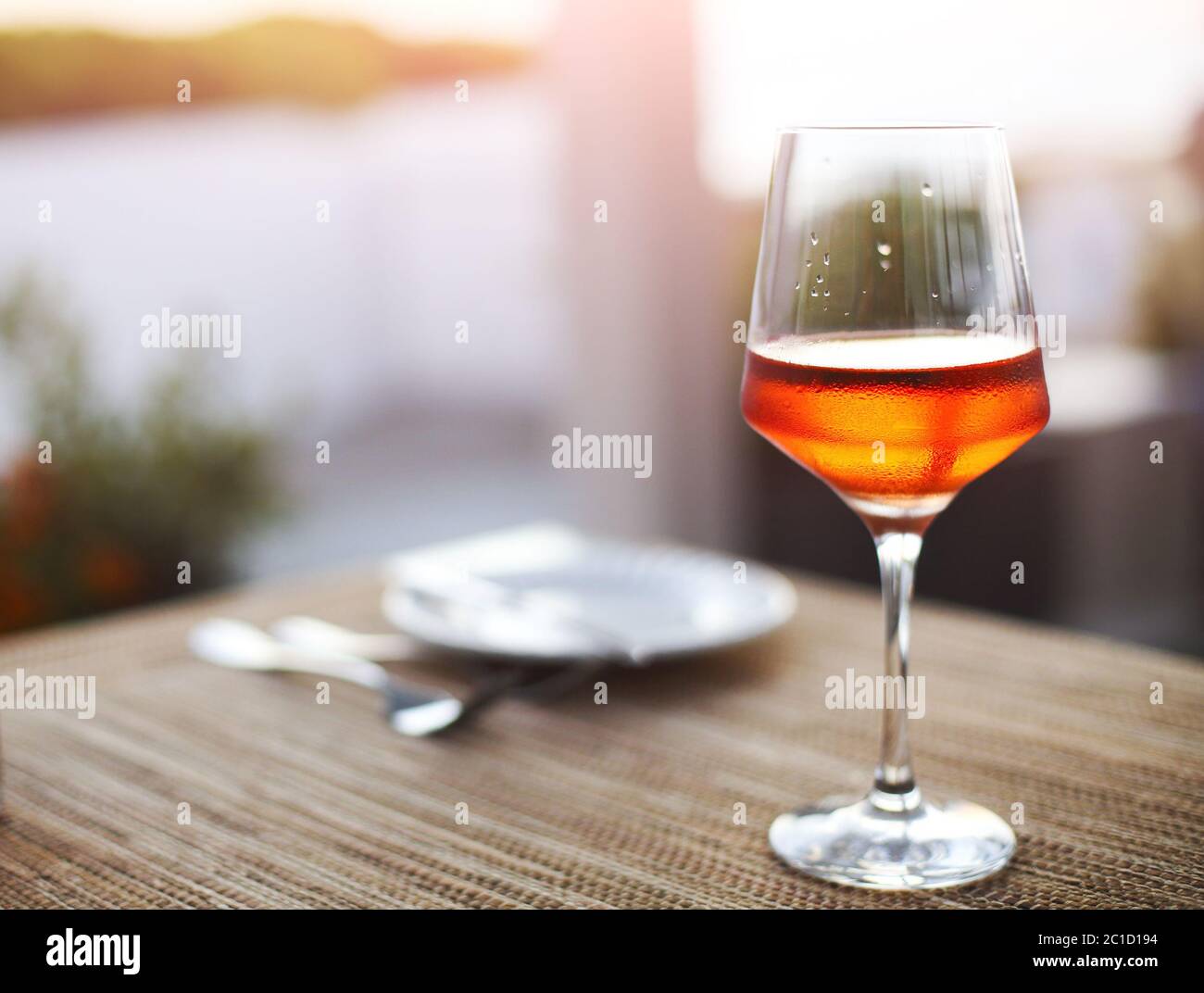 Glass of rose wine on table outdoor Stock Photo - Alamy