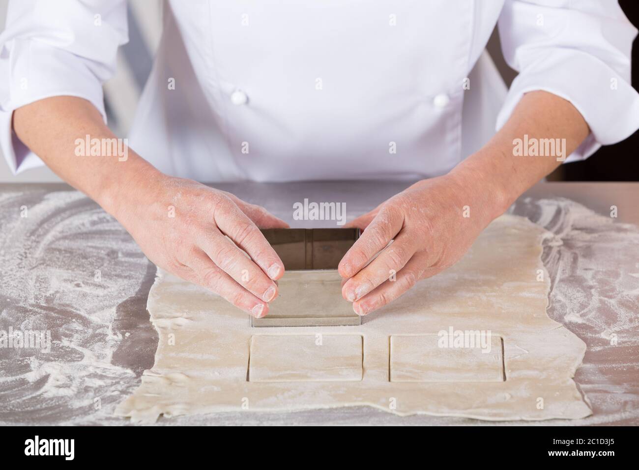 Pastry kneading a dough of a cake Stock Photo - Alamy