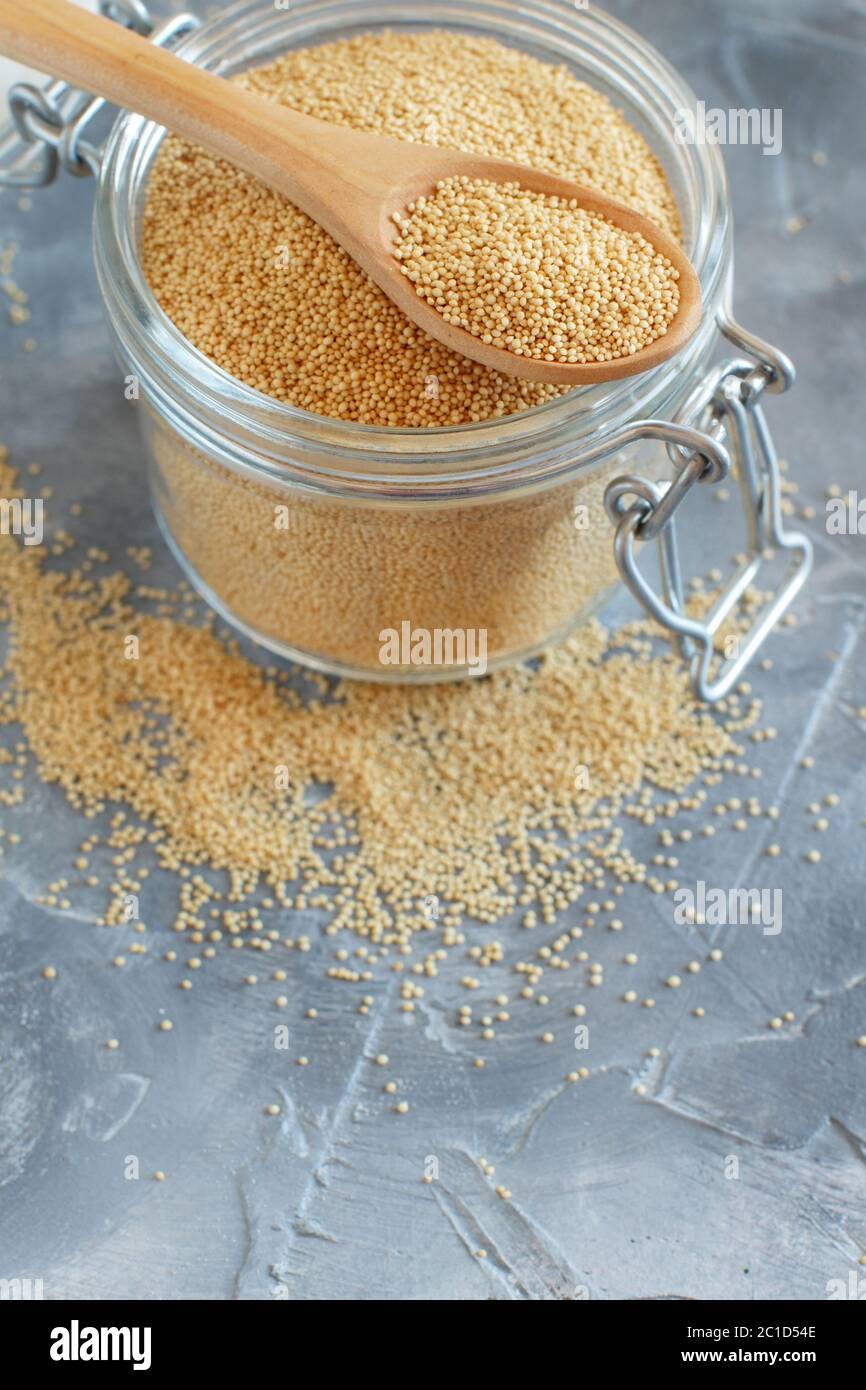 Jar of raw Amaranth Grain with a spoon close up Stock Photo - Alamy