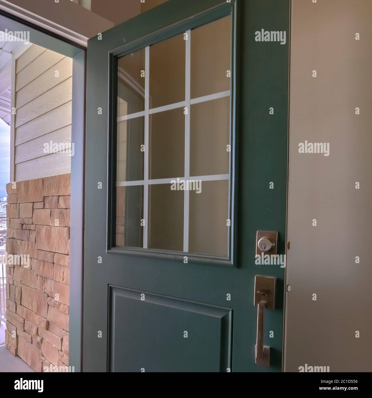 Square frame Looking out of an open front door of a house Stock Photo ...
