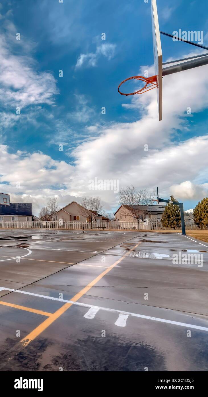 Vertical Basketball courts on neighborhood park with houses and ...
