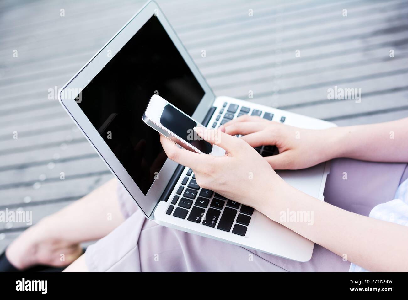 Hands laptop phone hi-res stock photography and images - Alamy