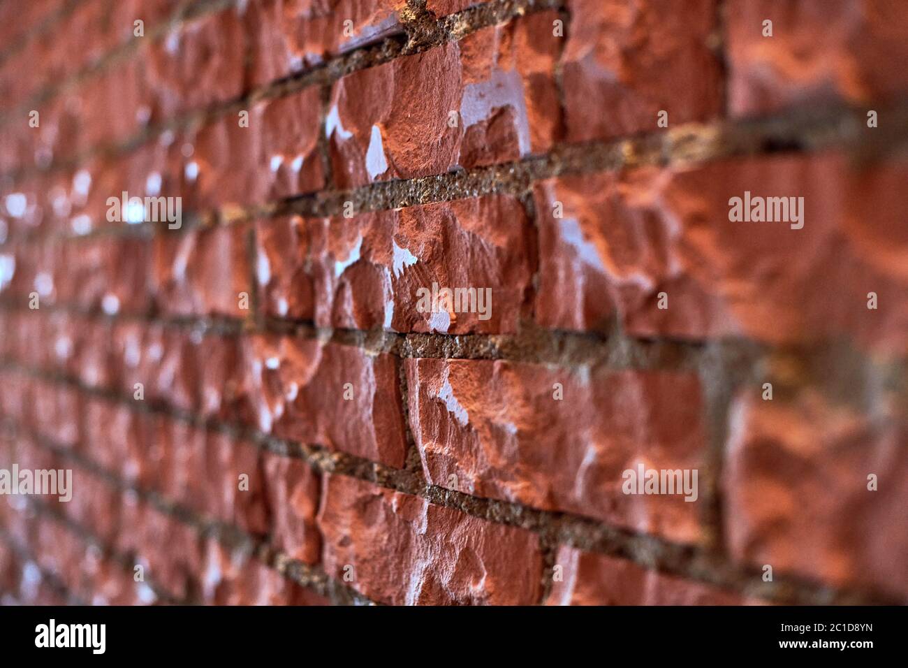 Loft red brick wall, angled view. Polished brick wall in attic interior ...
