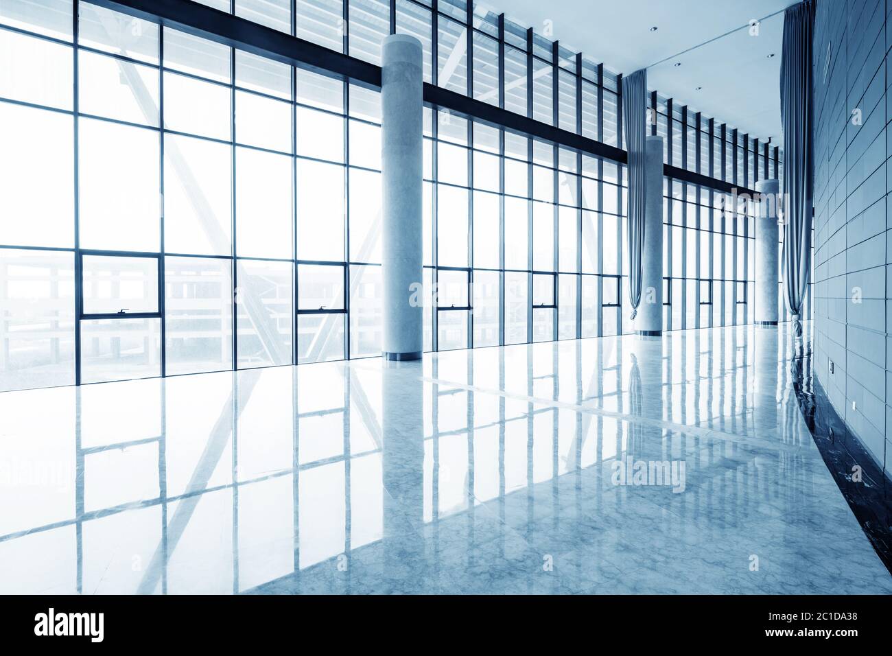 modern business hall interior with glass wall Stock Photo - Alamy