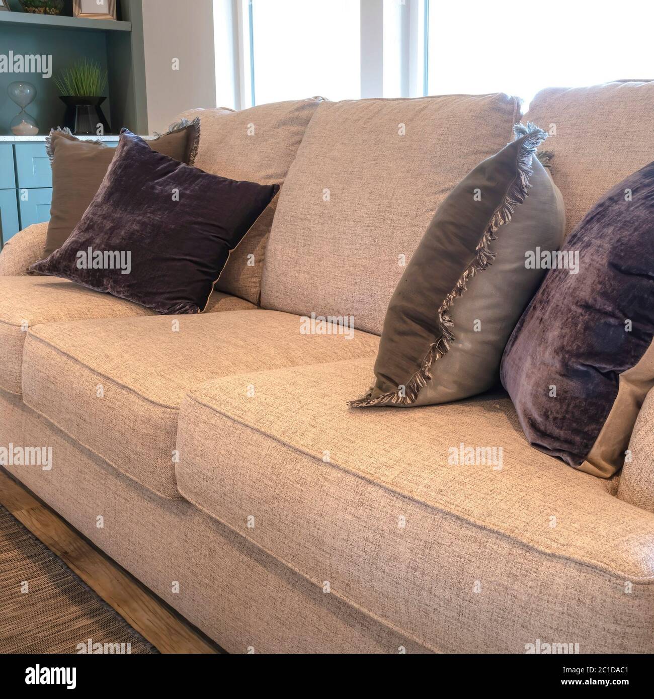 Square crop Living room interior with close up of cozy sofa against ...