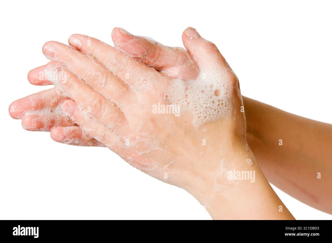 Lateral closeup with foamed hands on soap against white background ...