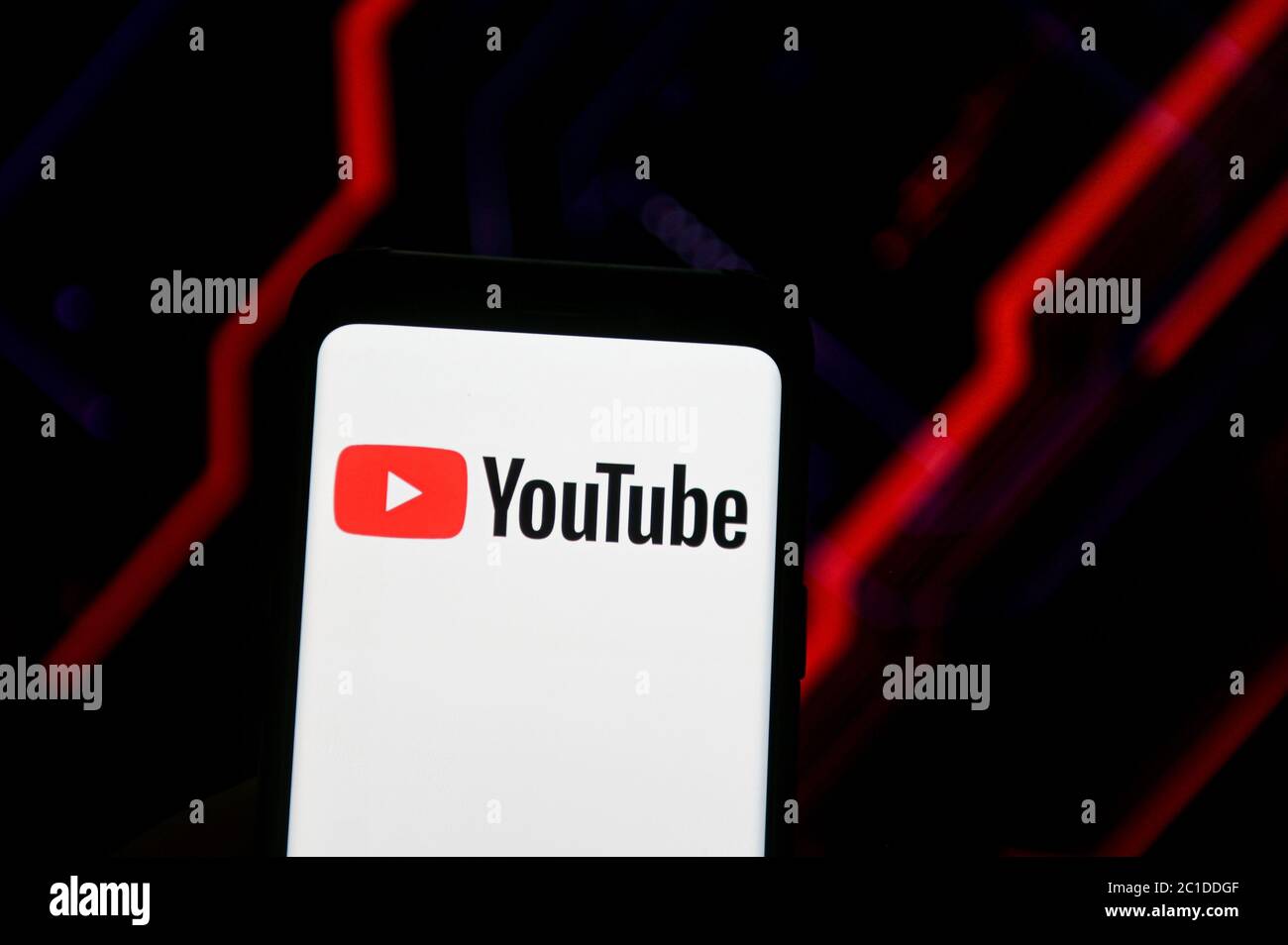 In this photo illustration a YouTube logo seen displayed on a ...