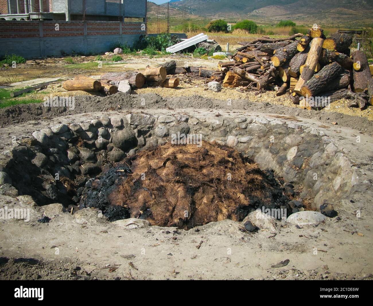 Oven with the agave pine aka pinas at the process of tequila production ...