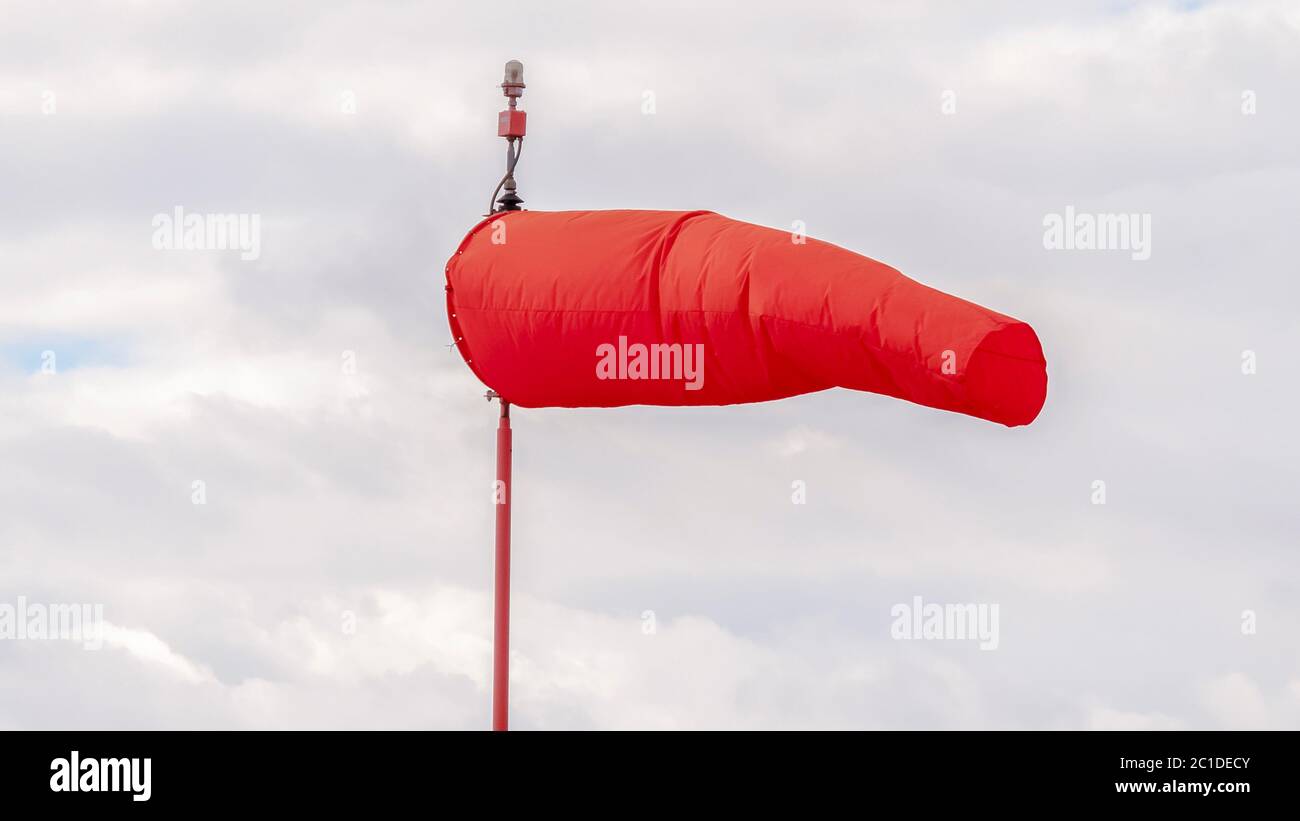 Panorama crop Red wind sock at an airport blowing in the wind Stock ...