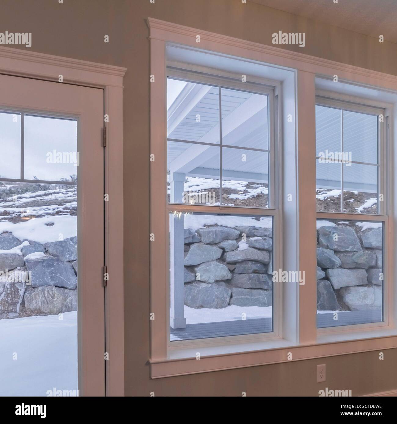 Square Looking out through a glass door and windows Stock Photo - Alamy