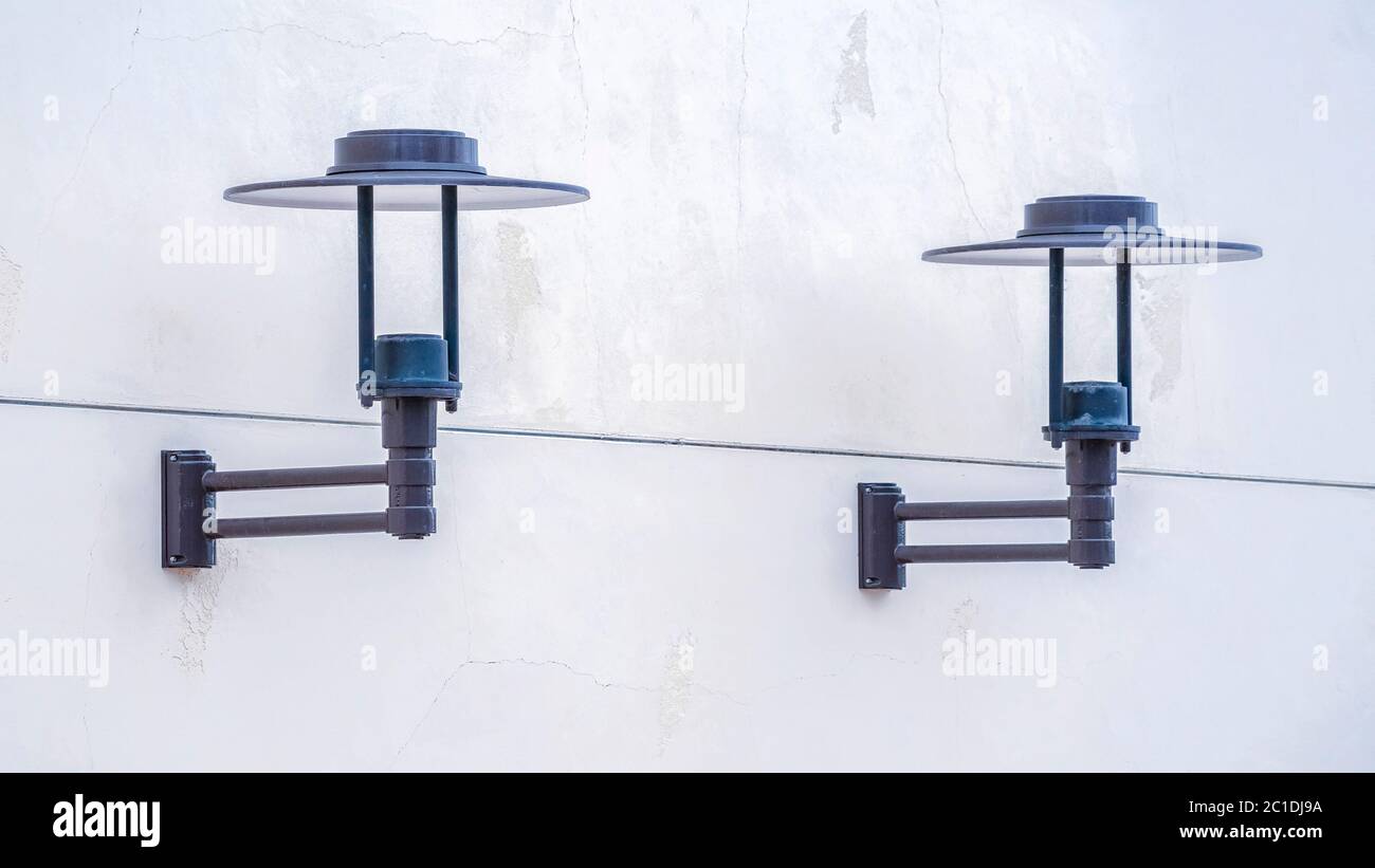 Panorama Two matching exterior electric lights on a wall Stock Photo ...