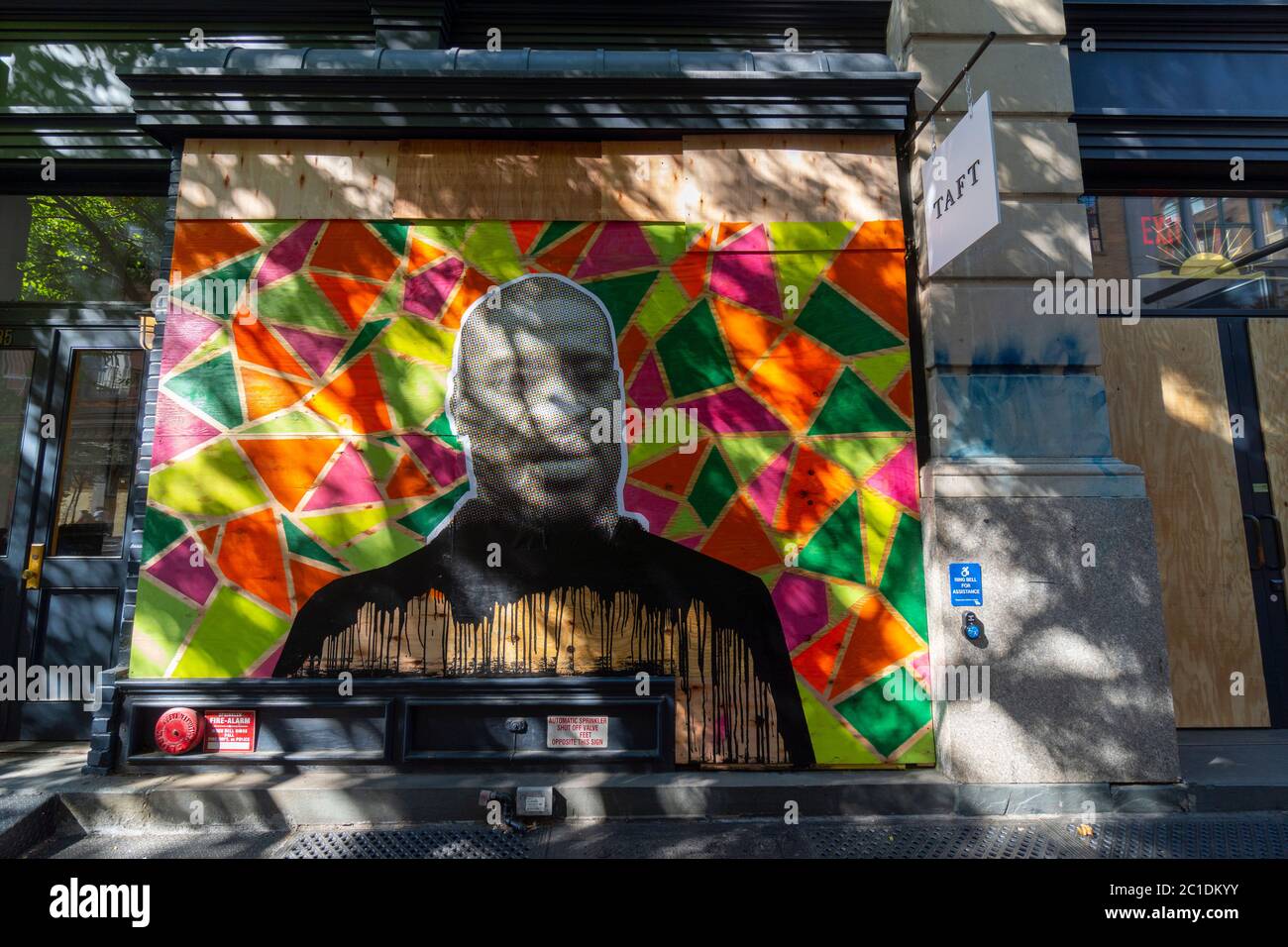 Artists draw Portrait of Jorge Floyd on the Barricade Board of stores ...