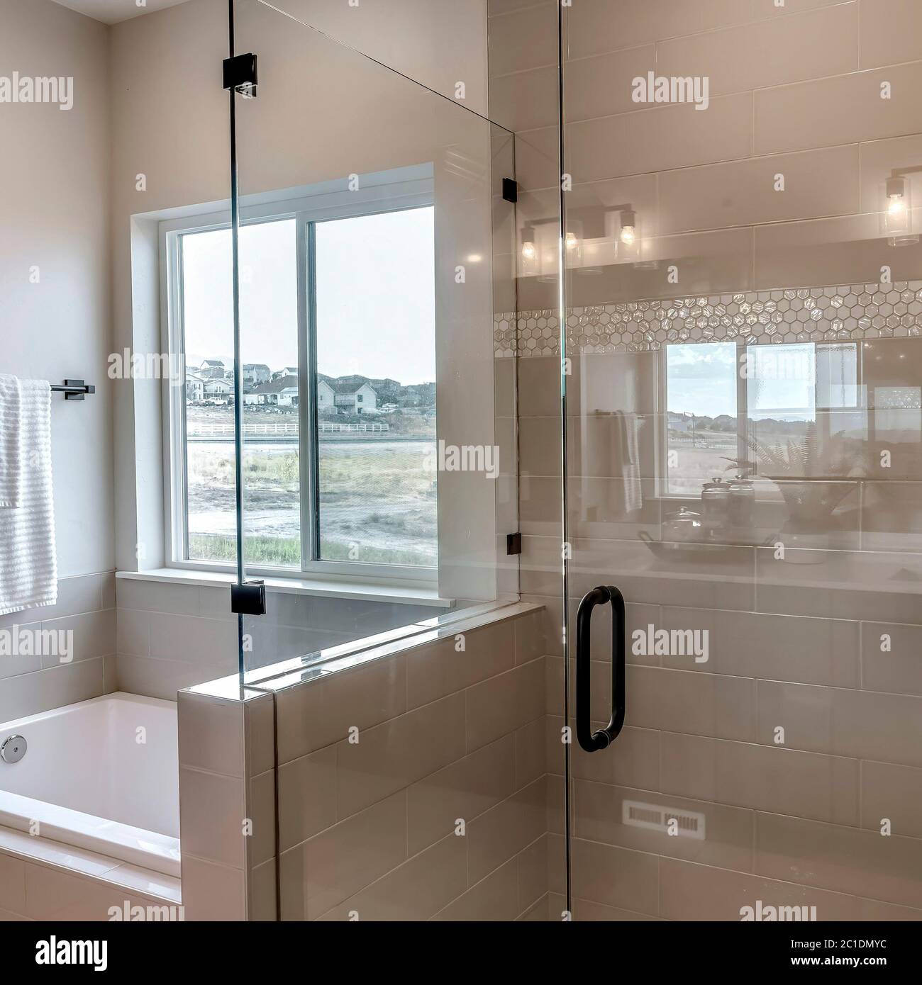 Square crop Frameless walk in shower stall and built in bathtub inside ...