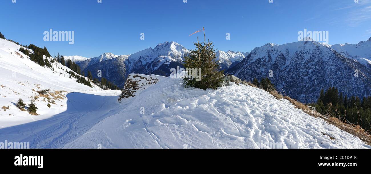 Snow-covered avalanche protection barrier in front of the high ...