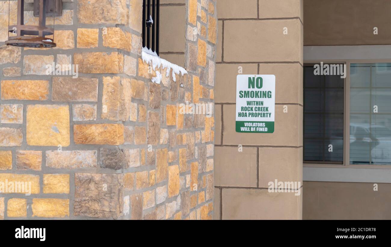 Panorama frame Exterior view of apartments with No Smoking sign on the ...