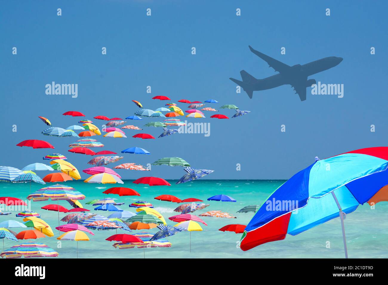 Tourist invasion parasols from airplane in tourist paradise Stock Photo ...