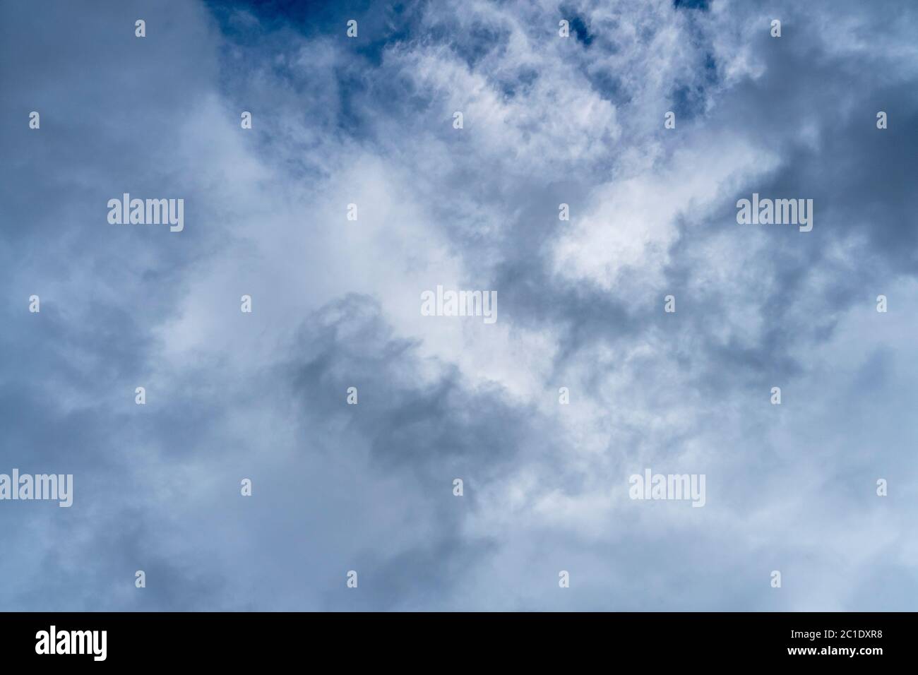 Cumulus clouds on a bright blue sky. Cloudy summer weather Stock Photo ...