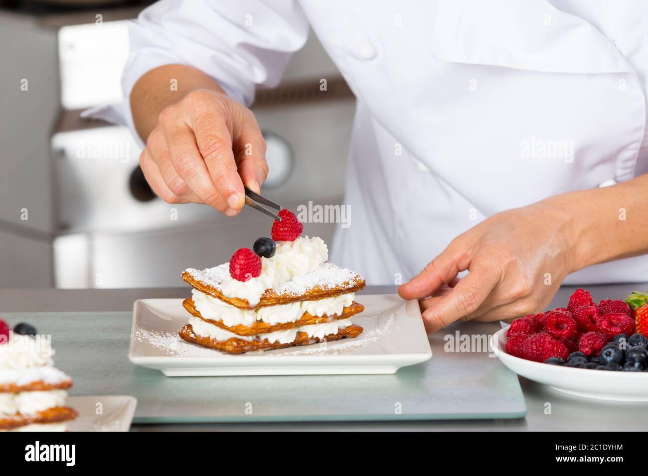 Woman decorating tasty pie hi-res stock photography and images - Alamy
