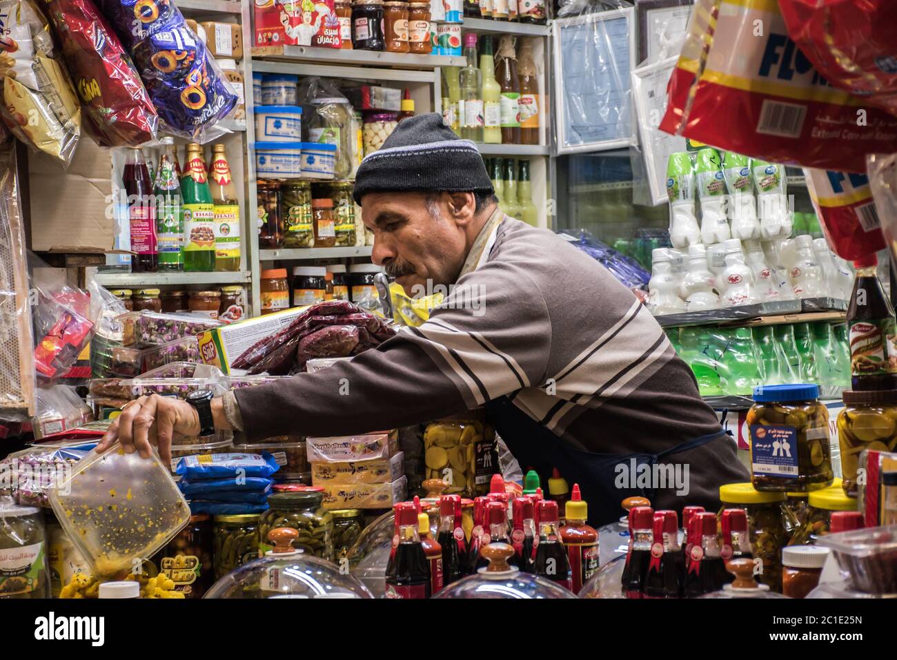 Arabic aged shopkeeper is the main subject focused who is from Iran ...