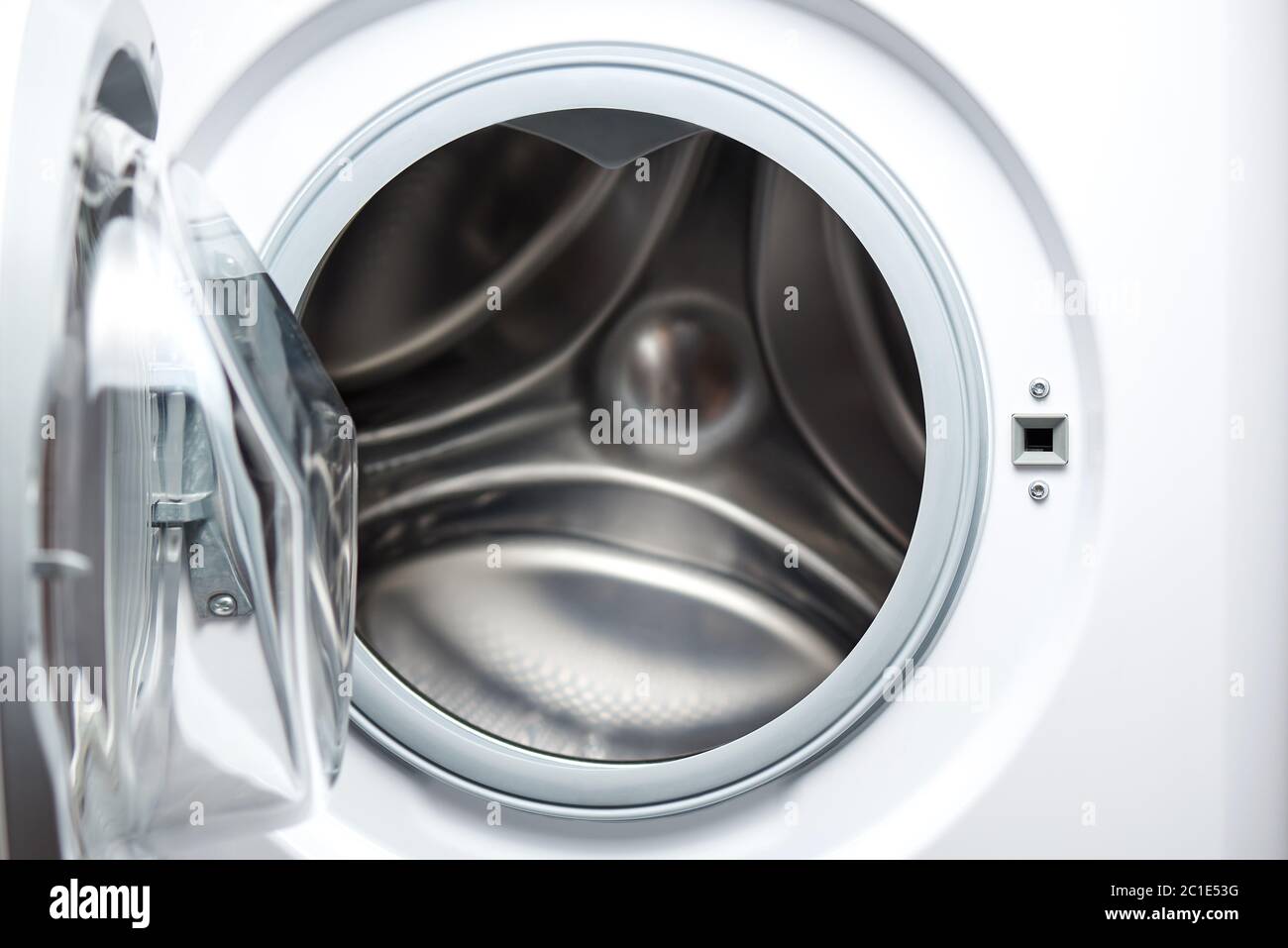 Open white washing machine close-up Stock Photo - Alamy