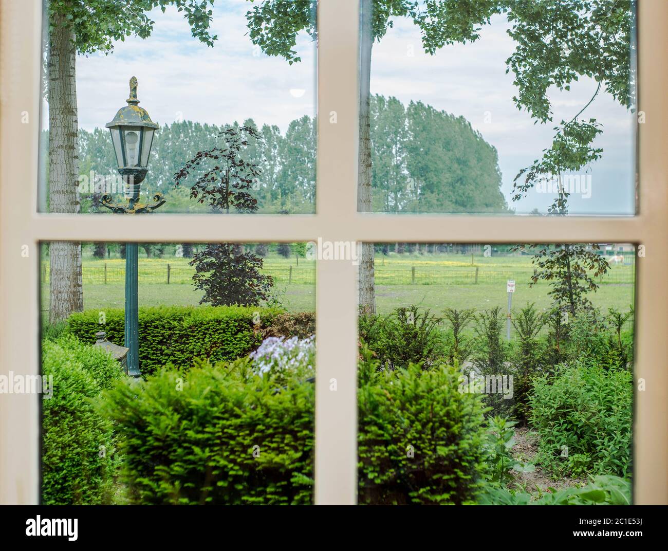 Classic white cozy window with green landscape meadow view Stock Photo ...
