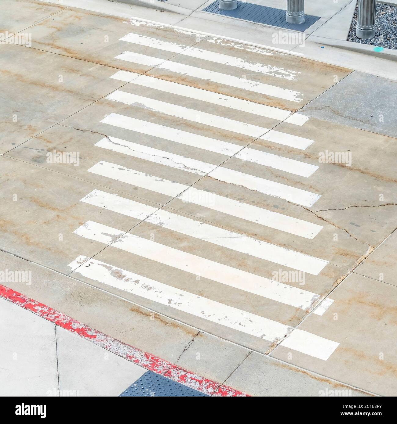 Square Pedestrian crossing white lines painted on the road in front of ...