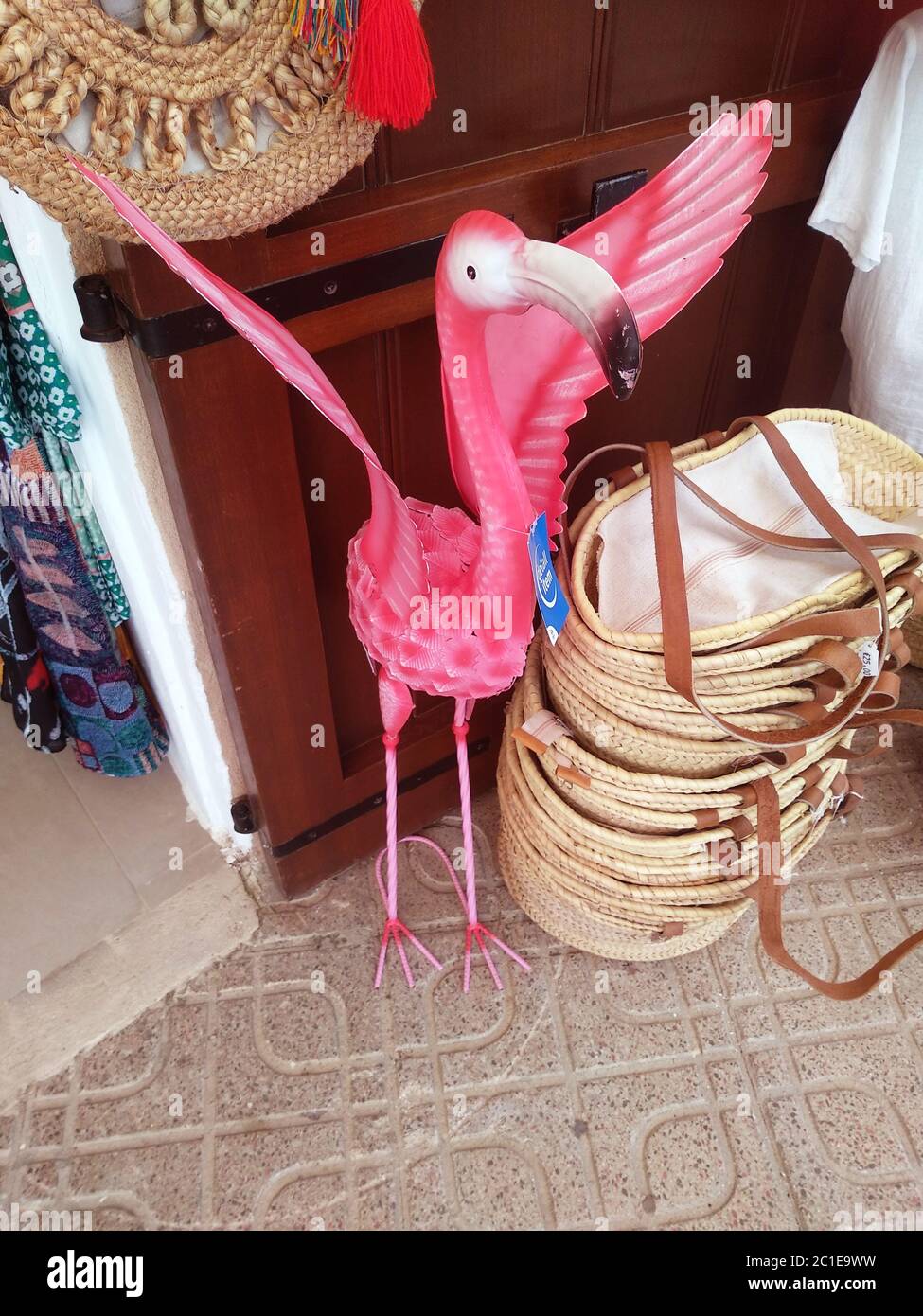 large fake pink flamingo with open wings for home decorations next to a ...