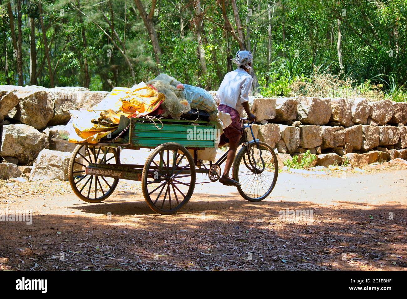 A labor worker carry goods for living in rural area of Kerala, located ...