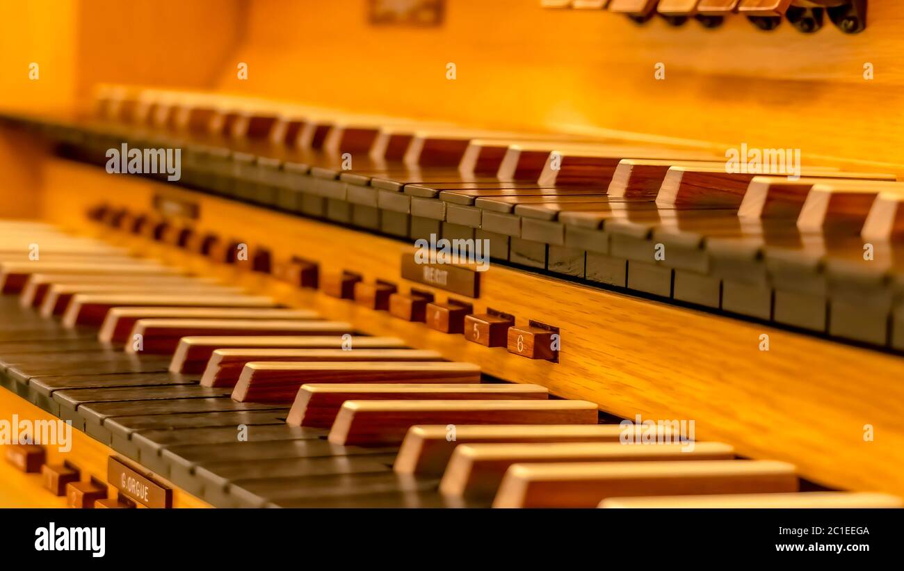 Panorama frame Close up of a beautiful piano with wooden keyboard and ...